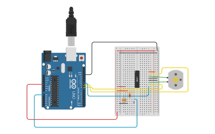 Circuit design mengontrol motor DC menggunakan sensor cahaya - Tinkercad