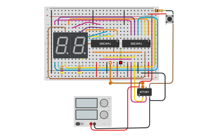 Circuit design Double Dice 7 seg. Display w. ATTiny85 - Tinkercad