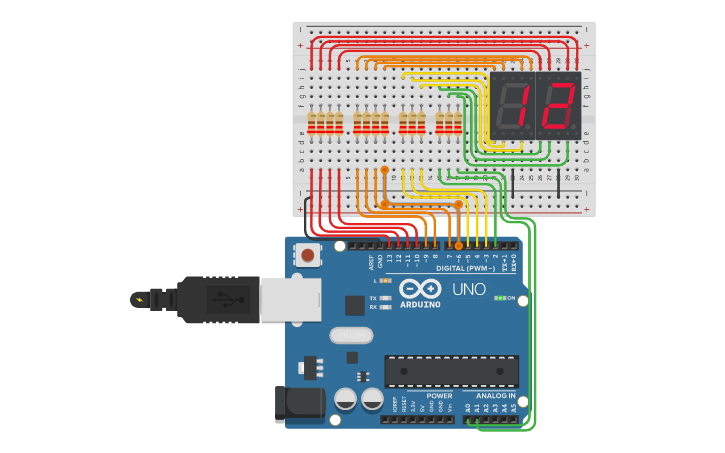 Circuit design 2 display a 7 segmenti contatore fino a 99 - Tinkercad