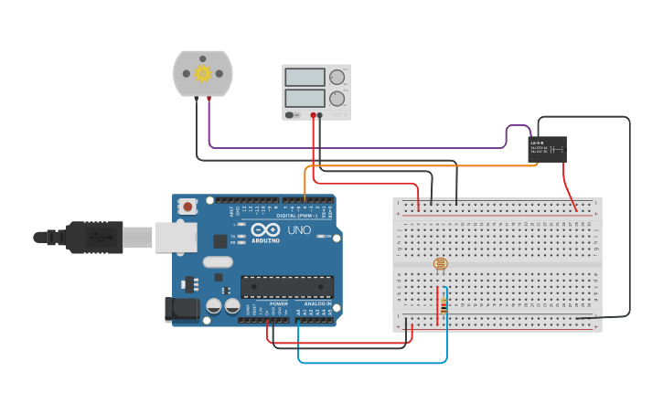 Circuit design controlling dc motor using relay - Tinkercad