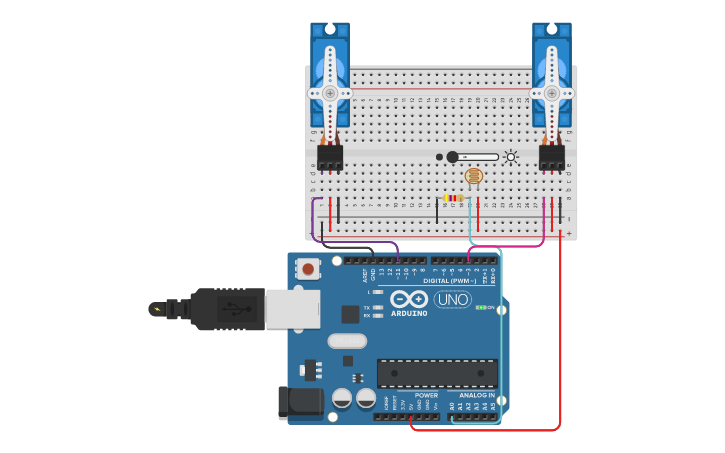 Circuit design Servos con sensor de luz - Tinkercad
