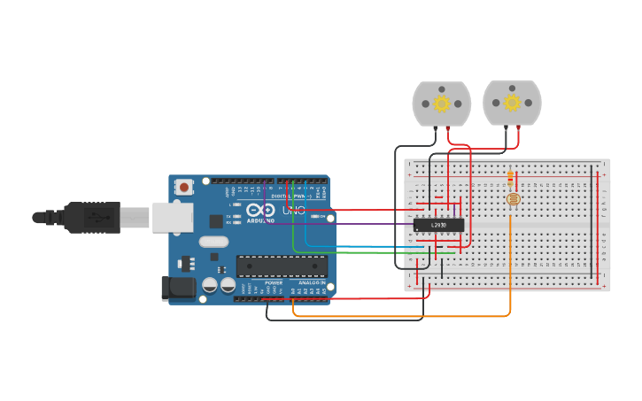 Circuit design Motores con_ LDR - Tinkercad